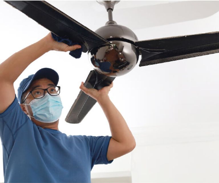 How to Clean Ceiling Fans Without Making a Mess - The Dust Devils